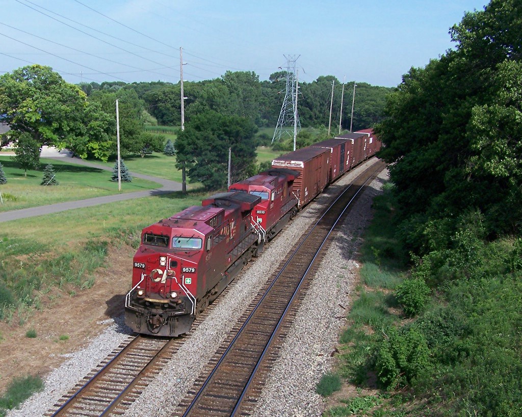 After a crew change, CP 9579 leads hot train #185 west